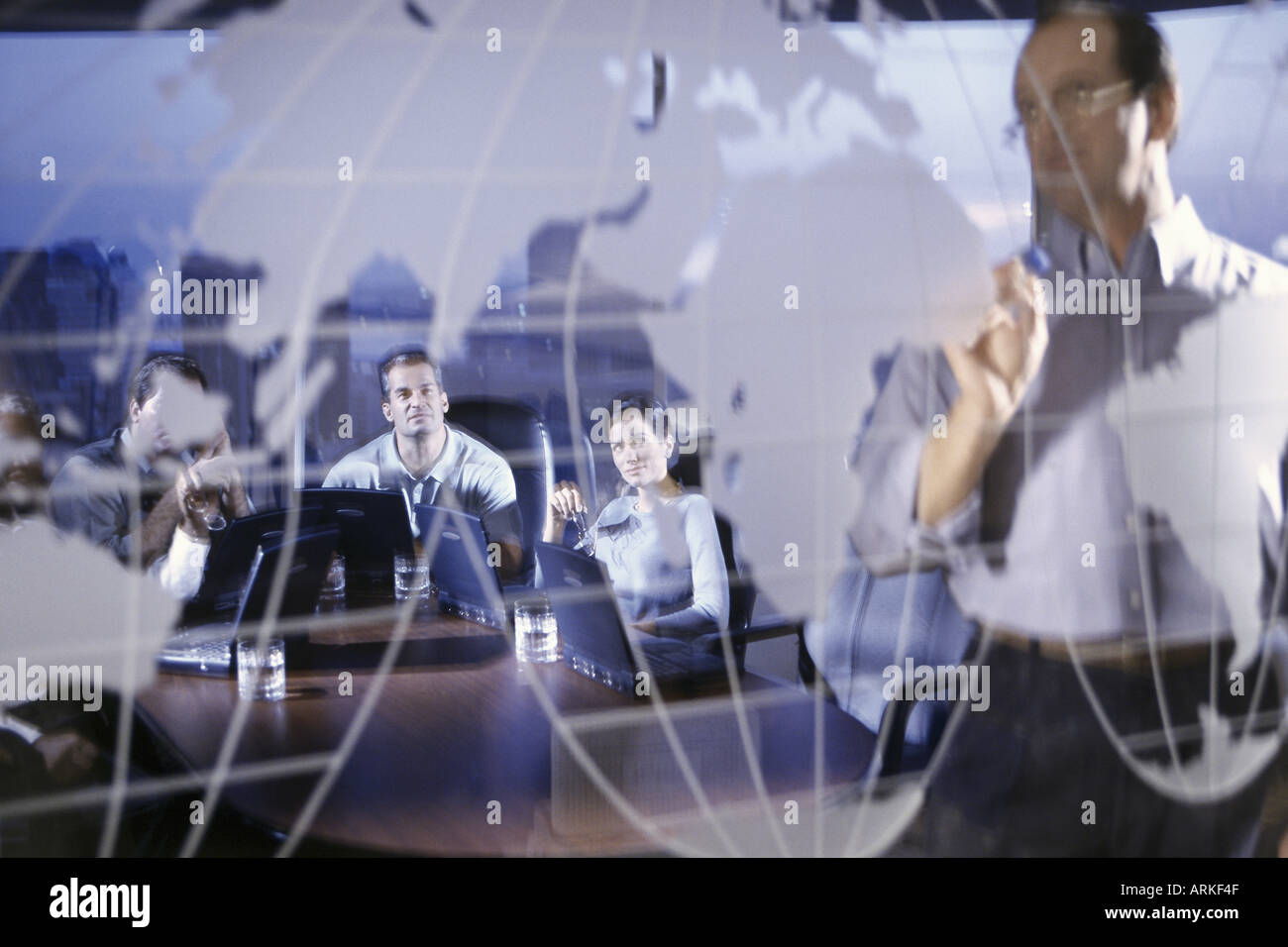 Businesspeople discussing map hi-res stock photography and images - Alamy