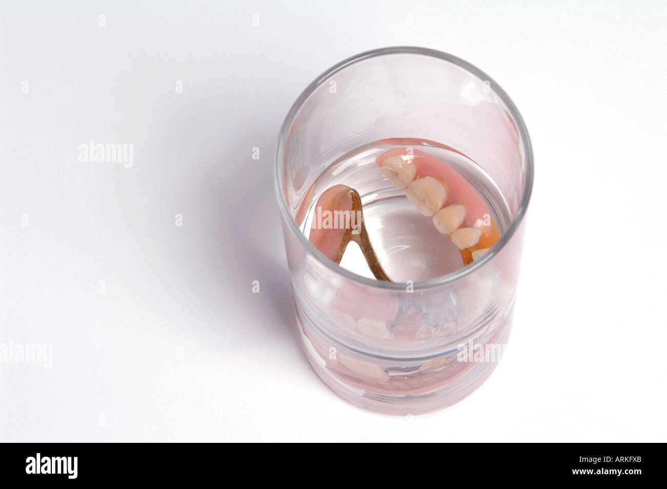 Set of teeth in a glass of water Stock Photo - Alamy