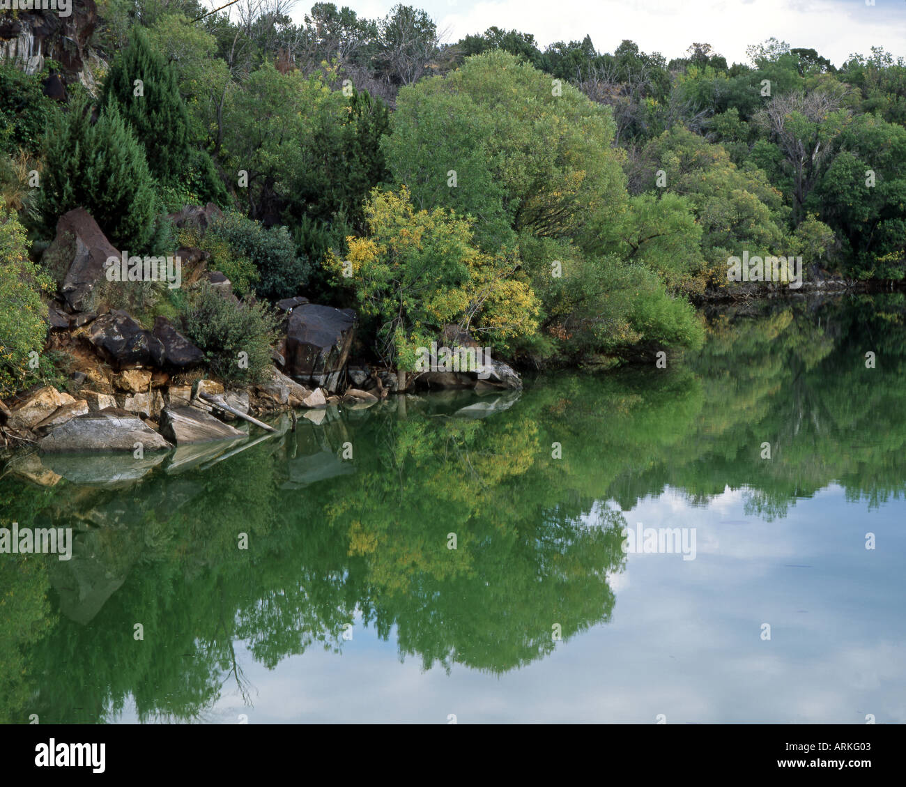 Still reflections on the water of Baker Dam Reservoir in southern Utah ...