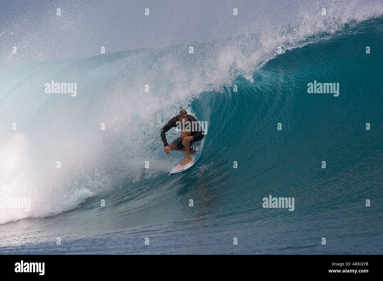 SURFER RIDING THROUGH BARREL INDONESIA Stock Photo - Alamy