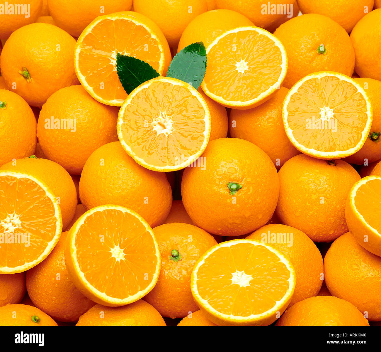 Orange halves and whole oranges Stock Photo - Alamy
