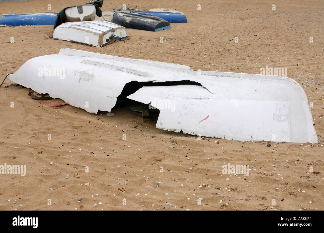 Broken white fibreglass rowing boat hi-res stock photography and images ...