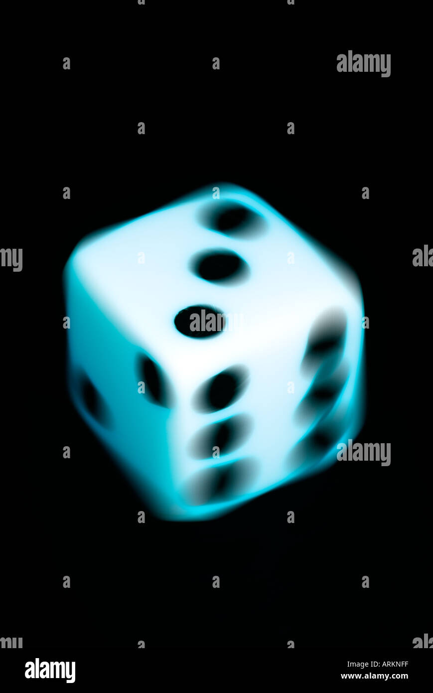 white spinning die concept image Stock Photo - Alamy