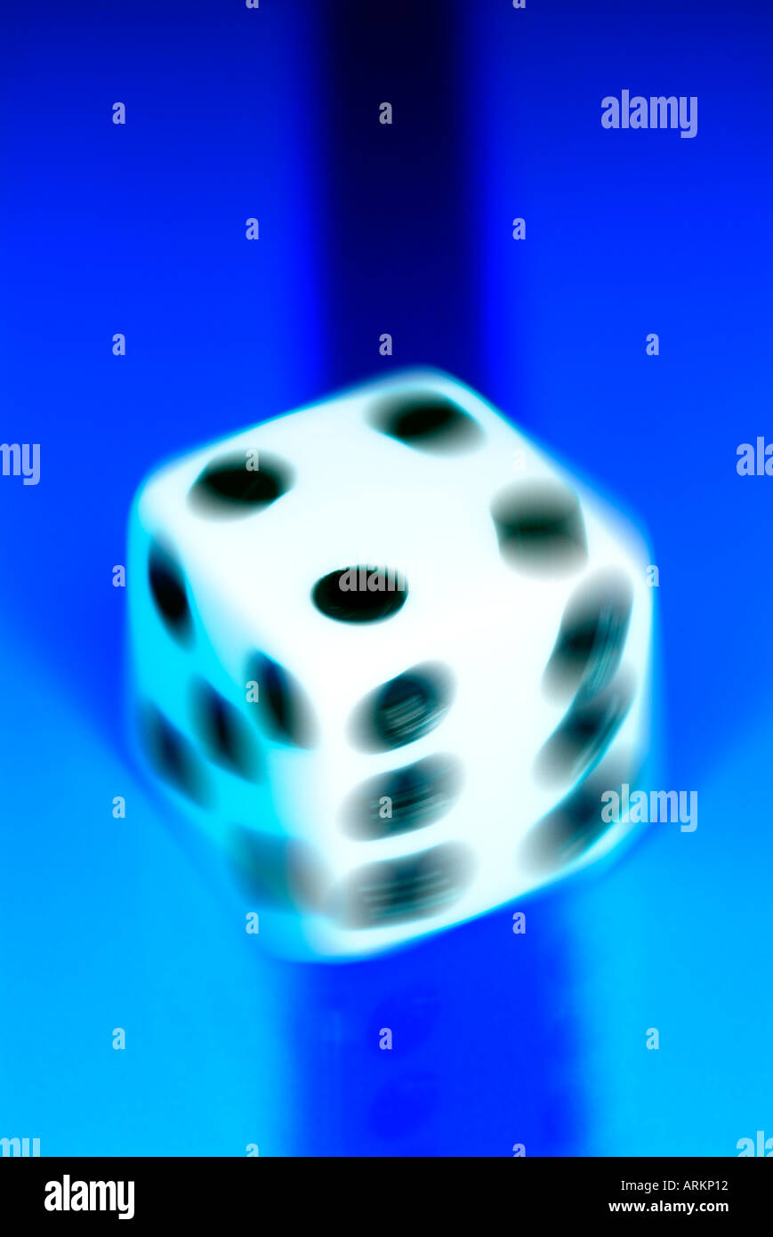 white spinning die concept image Stock Photo - Alamy