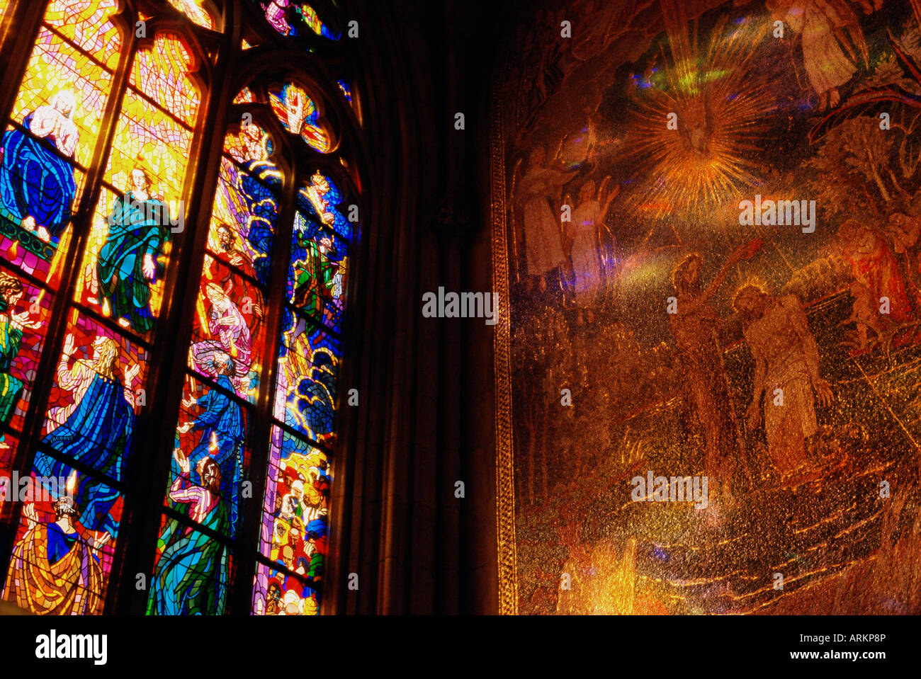Stained glass window throwing light on fresco, St. Vitus Cathedral ...
