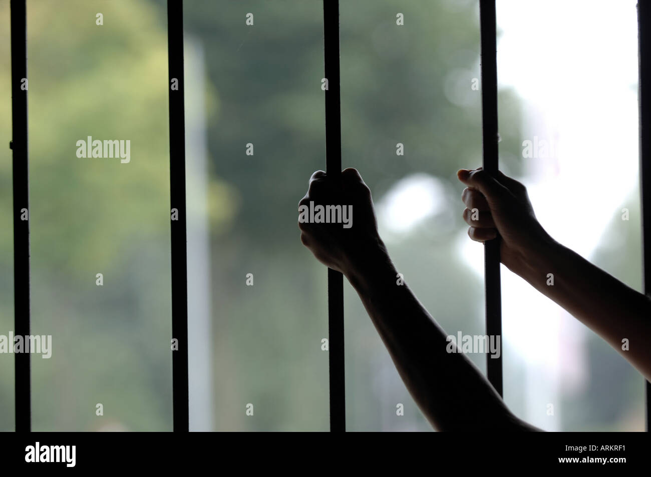 arms, hands on bars, incarcerated, prisoner, prison Stock Photo - Alamy