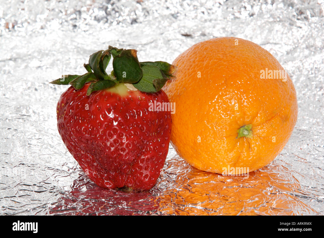 isolated perfect orange and strawberry on silver Stock Photo - Alamy