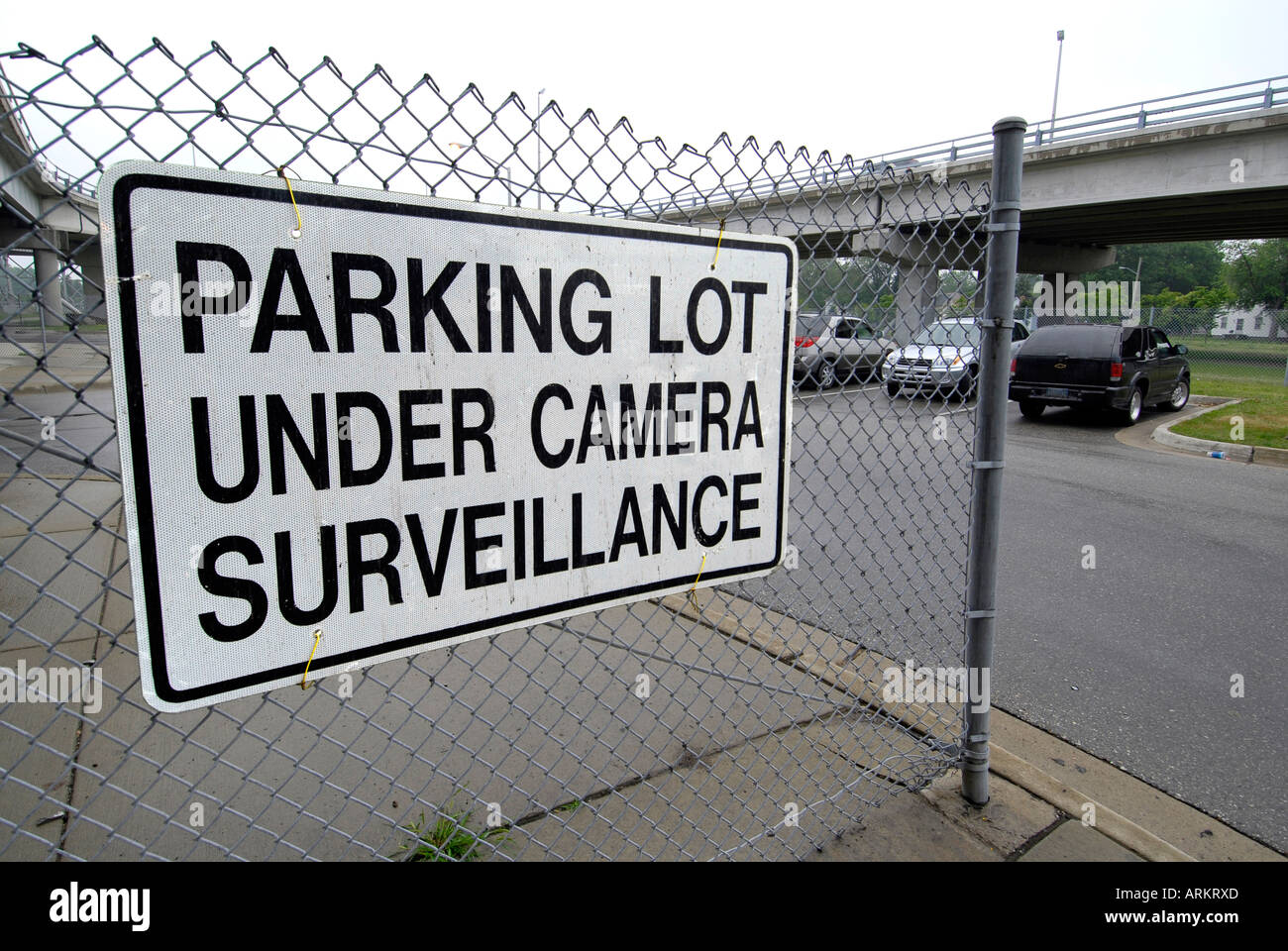 Parking lot under camera surveillance sign Stock Photo - Alamy