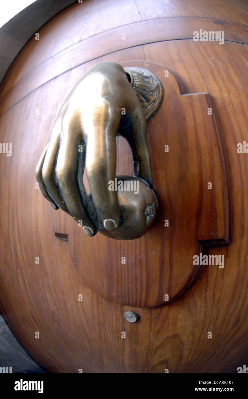 brass hand knocker Stock Photo - Alamy