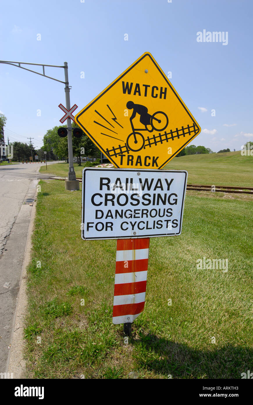 Railroad crossing sign stating railway crossing is dangerous for ...