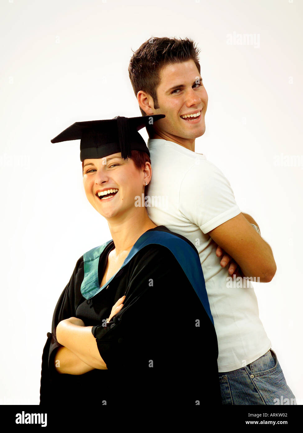 Female graduate student leaning against with boyfriend, smiling Stock ...