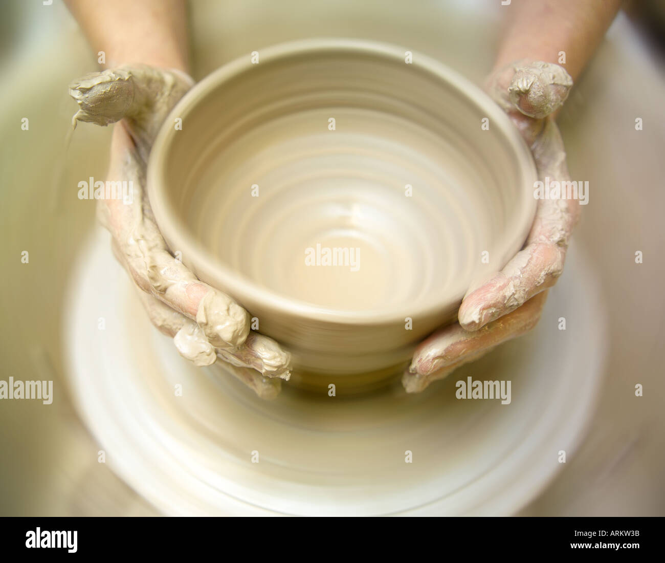 Person making ceramic pot on potters wheel Stock Photo - Alamy