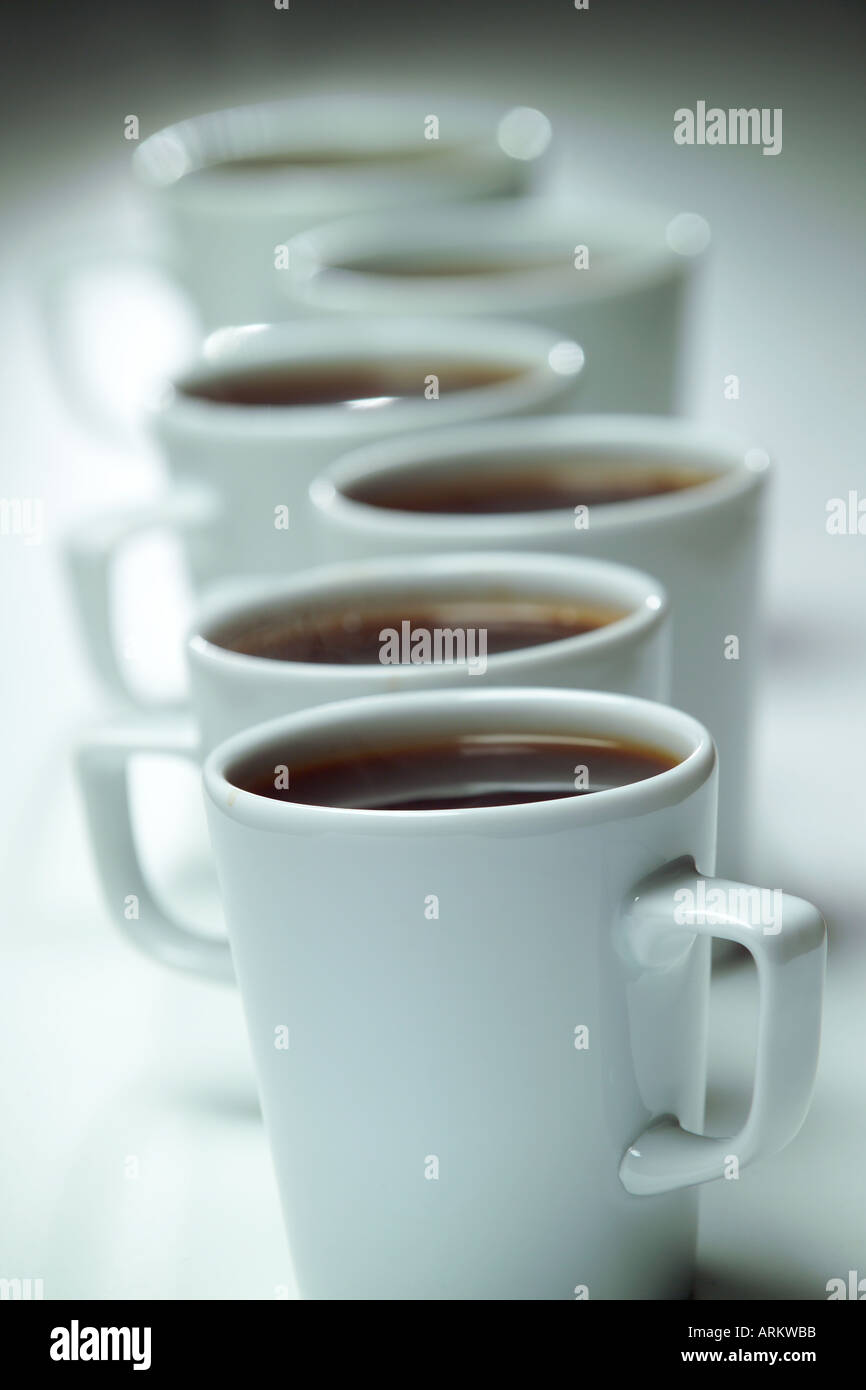 Coffee mugs in a row Stock Photo - Alamy