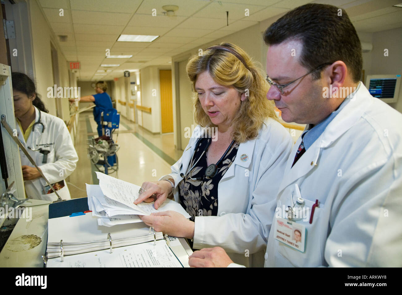 Doctor and Nurse Check Patient Records Stock Photo - Alamy