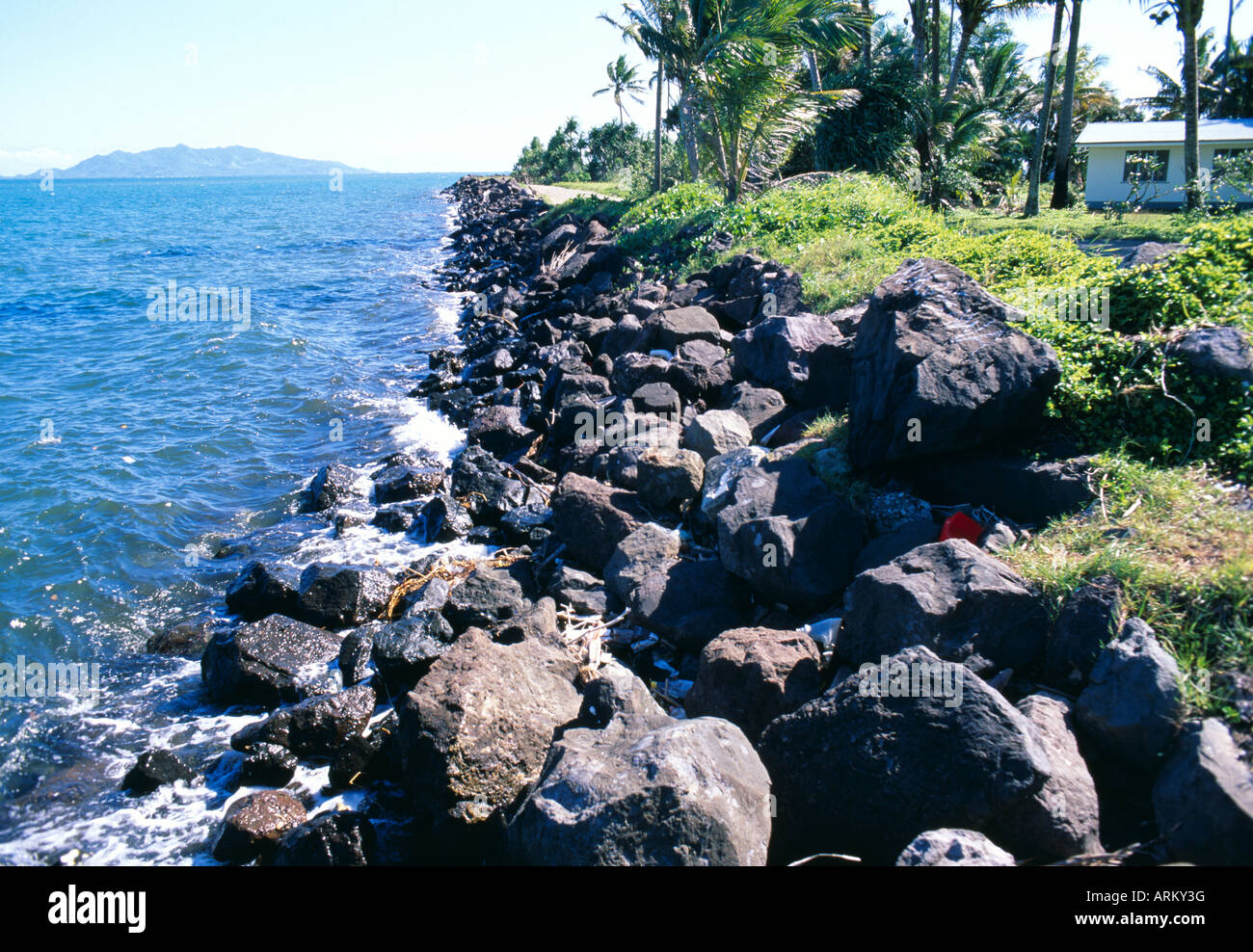 Stone wall on beach in Fiji Stock Photo - Alamy
