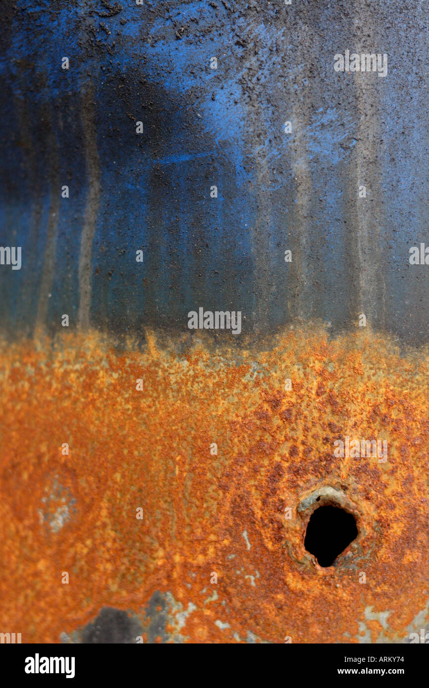 Rusty hole in an oil barrel Stock Photo - Alamy