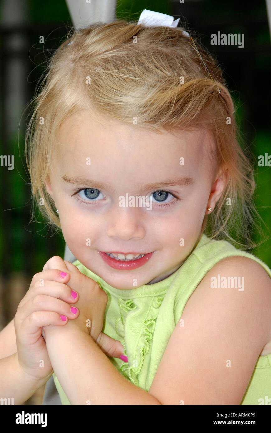 Portrait of a small toddler female child looking into the camera Stock ...