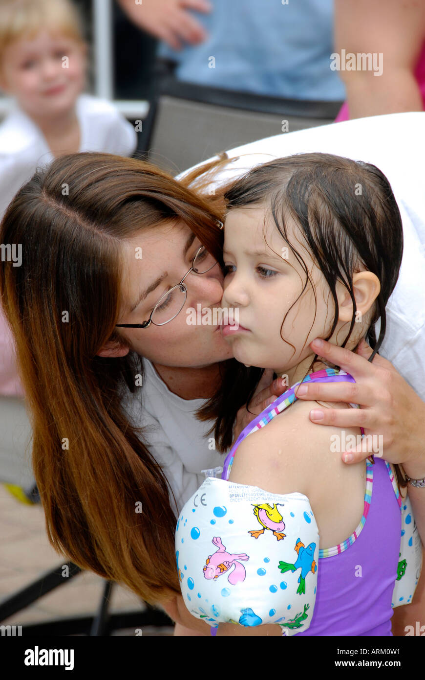 Mother kissing daughter Stock Photo - Alamy