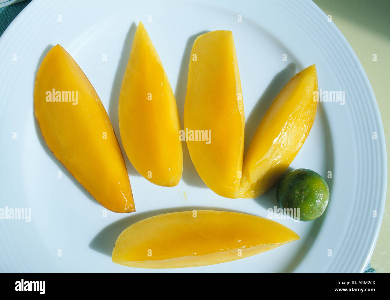 Sliced mango on a plate Stock Photo - Alamy