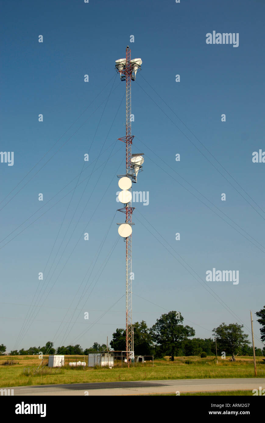 Communication towers with microwave dishes to gather and forward ...