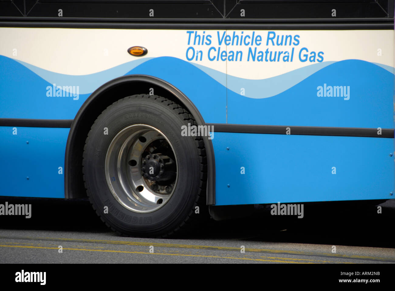 Sign on city bus showing that this vehicle runs on clean natural gas ...