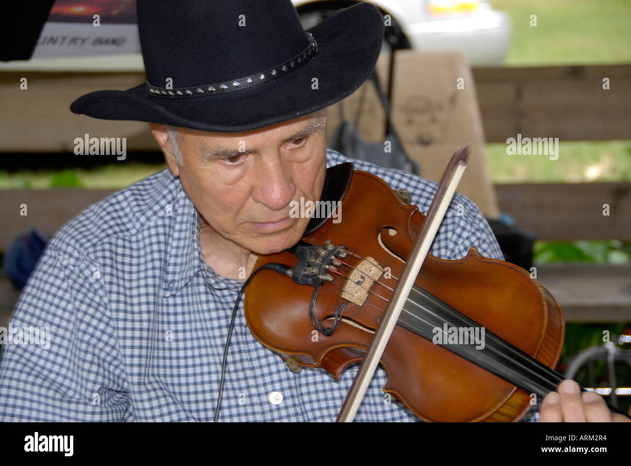 Old musicians play music at a senior citizen gathering in a public park ...