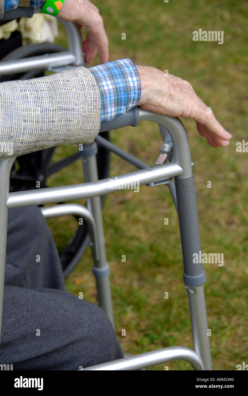 Handicapped males sits with arms supported by a walker device Stock ...
