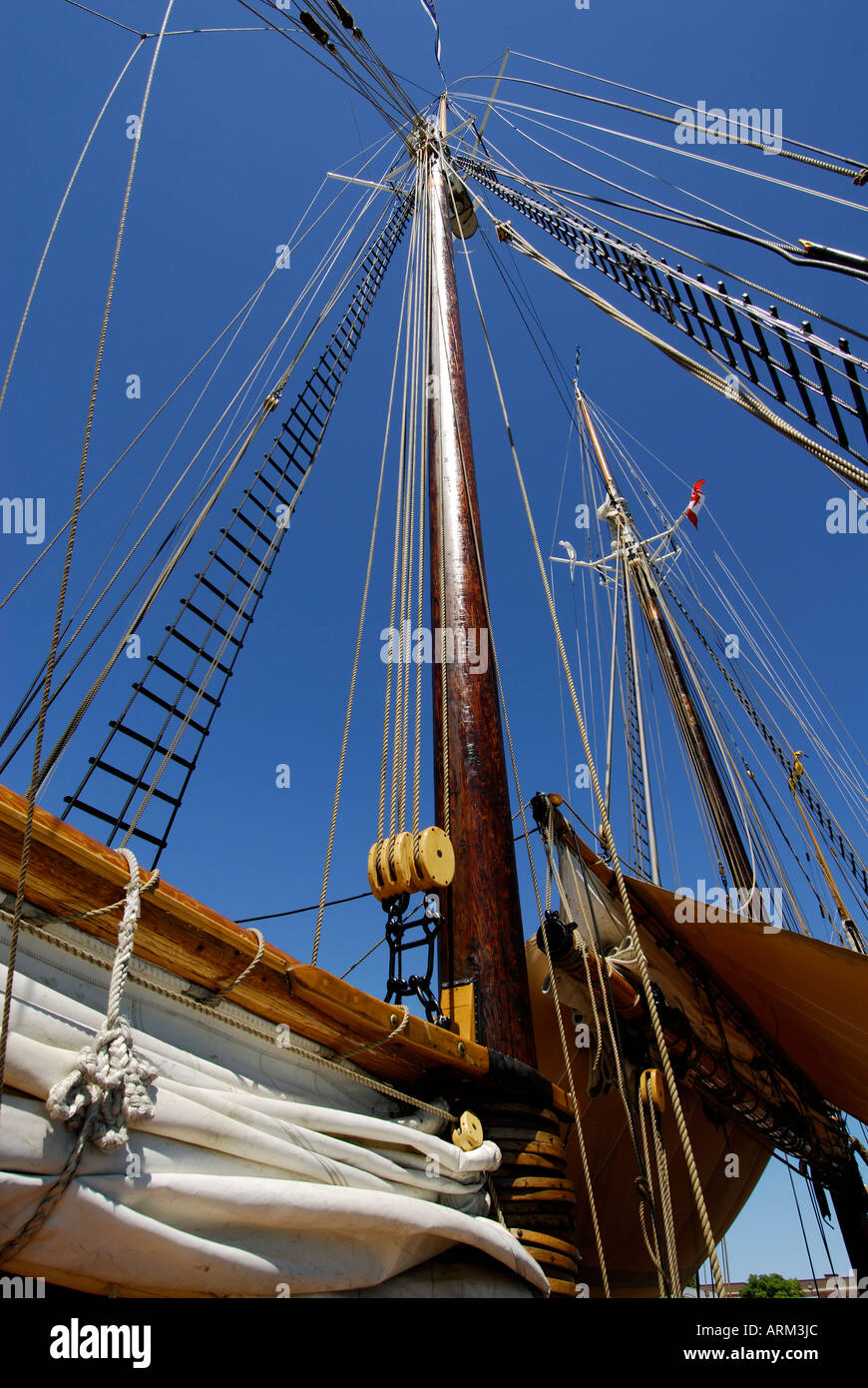 The masts of a tall ship sailing vessel show many angles with ropes and ...