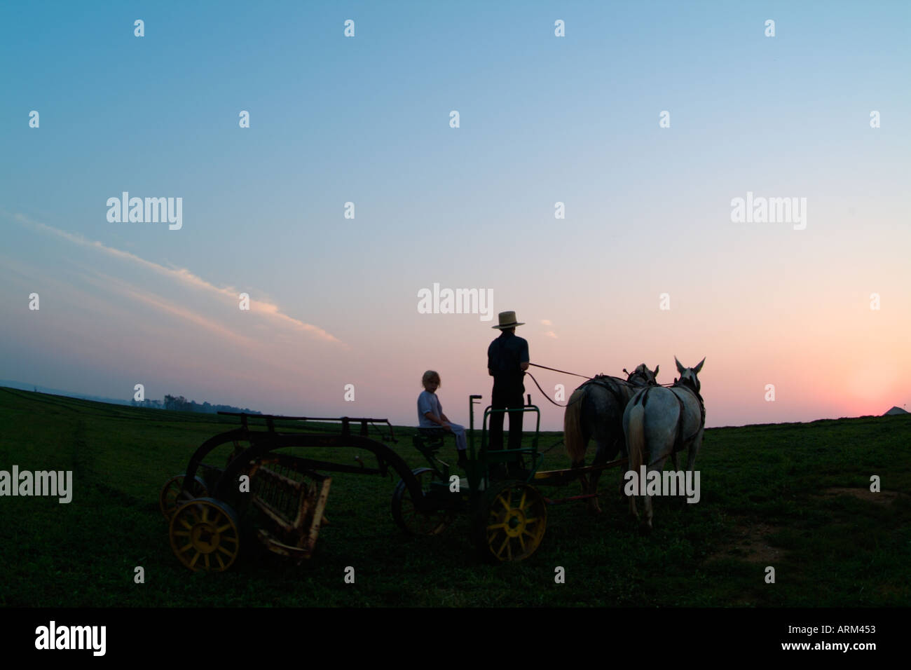 Old Amish Farm with man on plow working fields Lancaster Pennsylvania ...