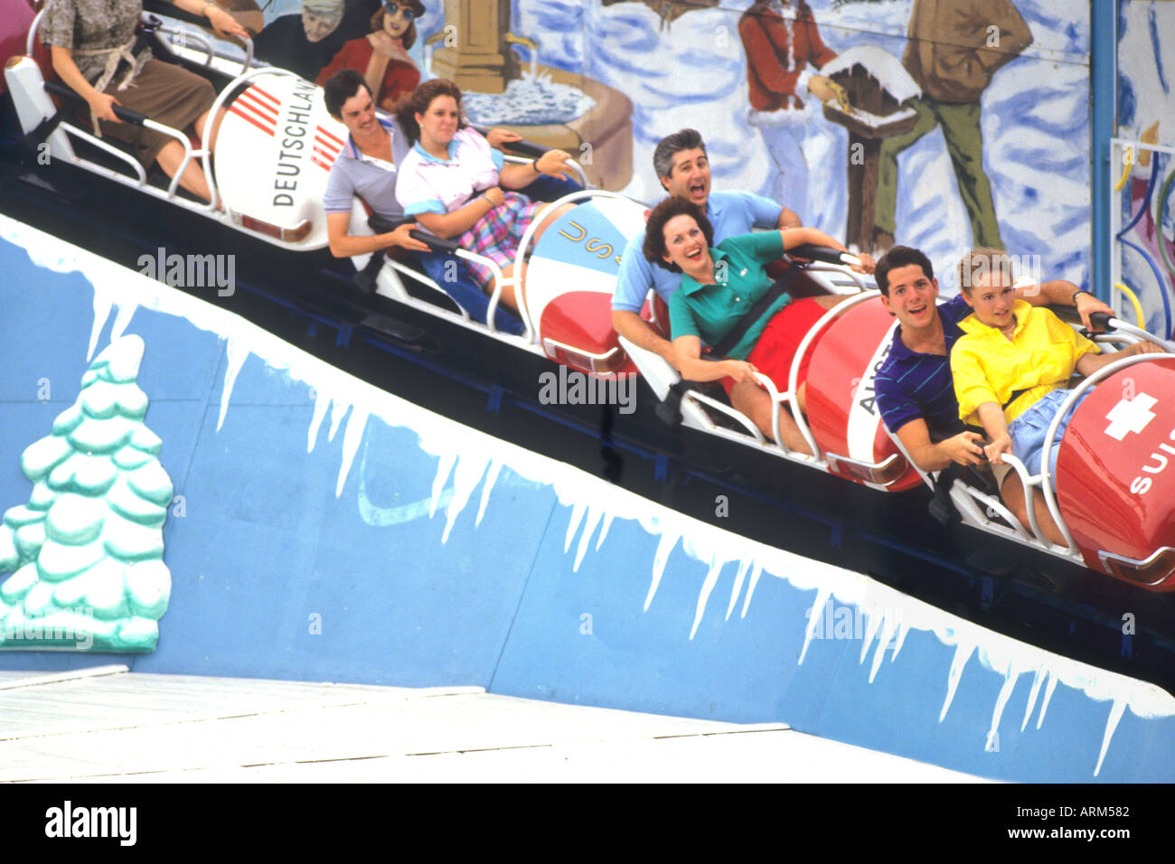 Amusement Park Roller coaster Ride with Tourists Stock Photo - Alamy