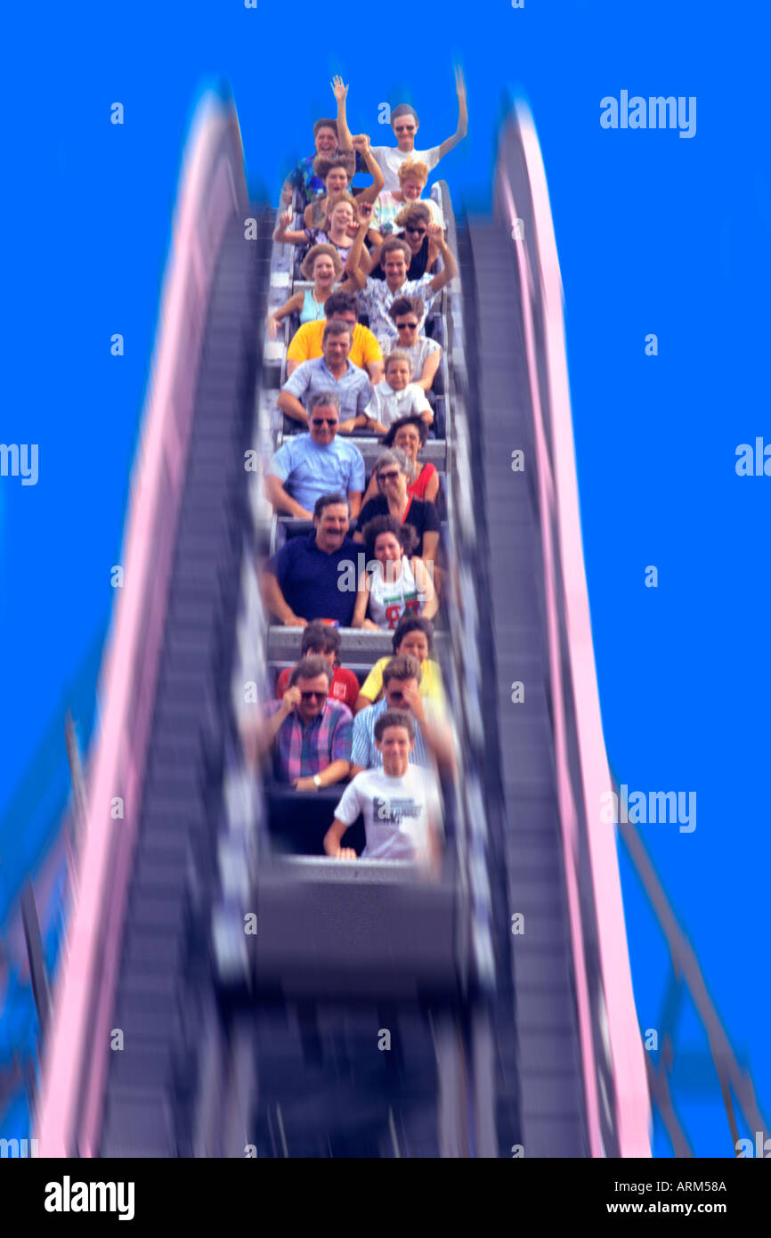 Amusement Park Roller coaster Ride with Tourists Stock Photo - Alamy