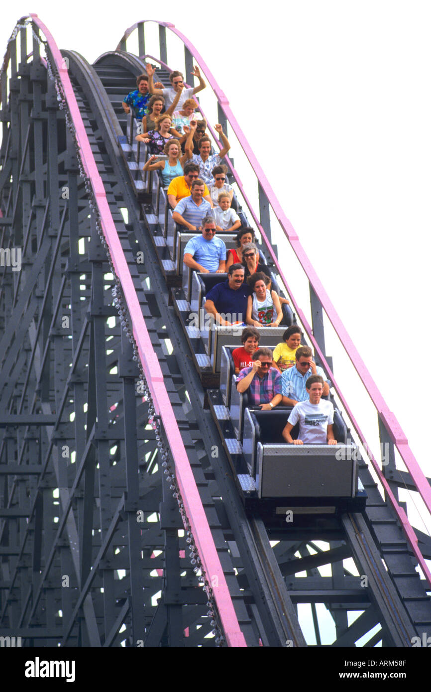 Amusement Park Roller coaster Ride with Tourists Stock Photo - Alamy