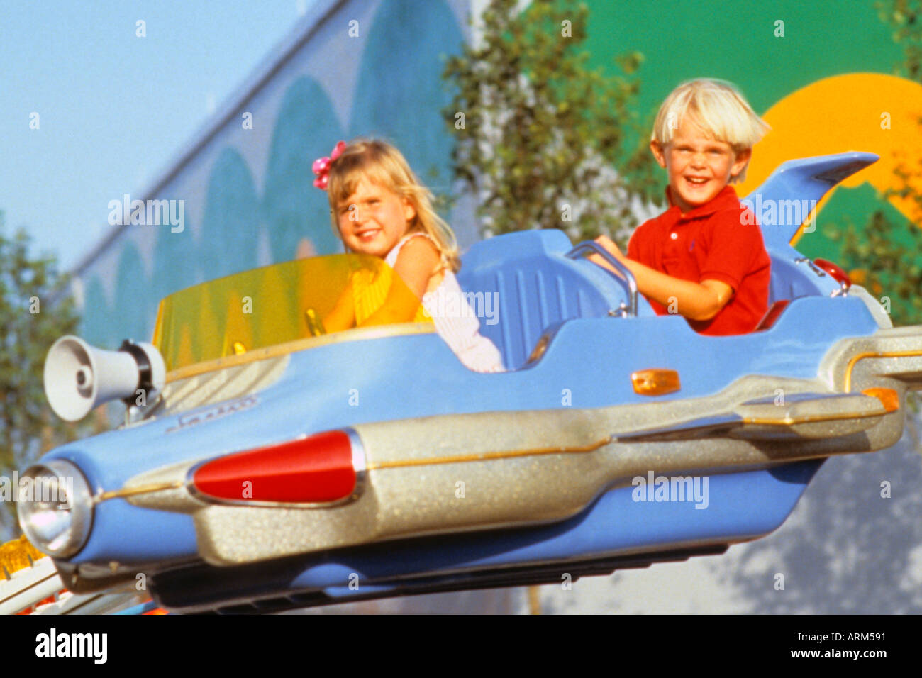 Amusement Park Roller coaster Ride with Tourists Stock Photo - Alamy