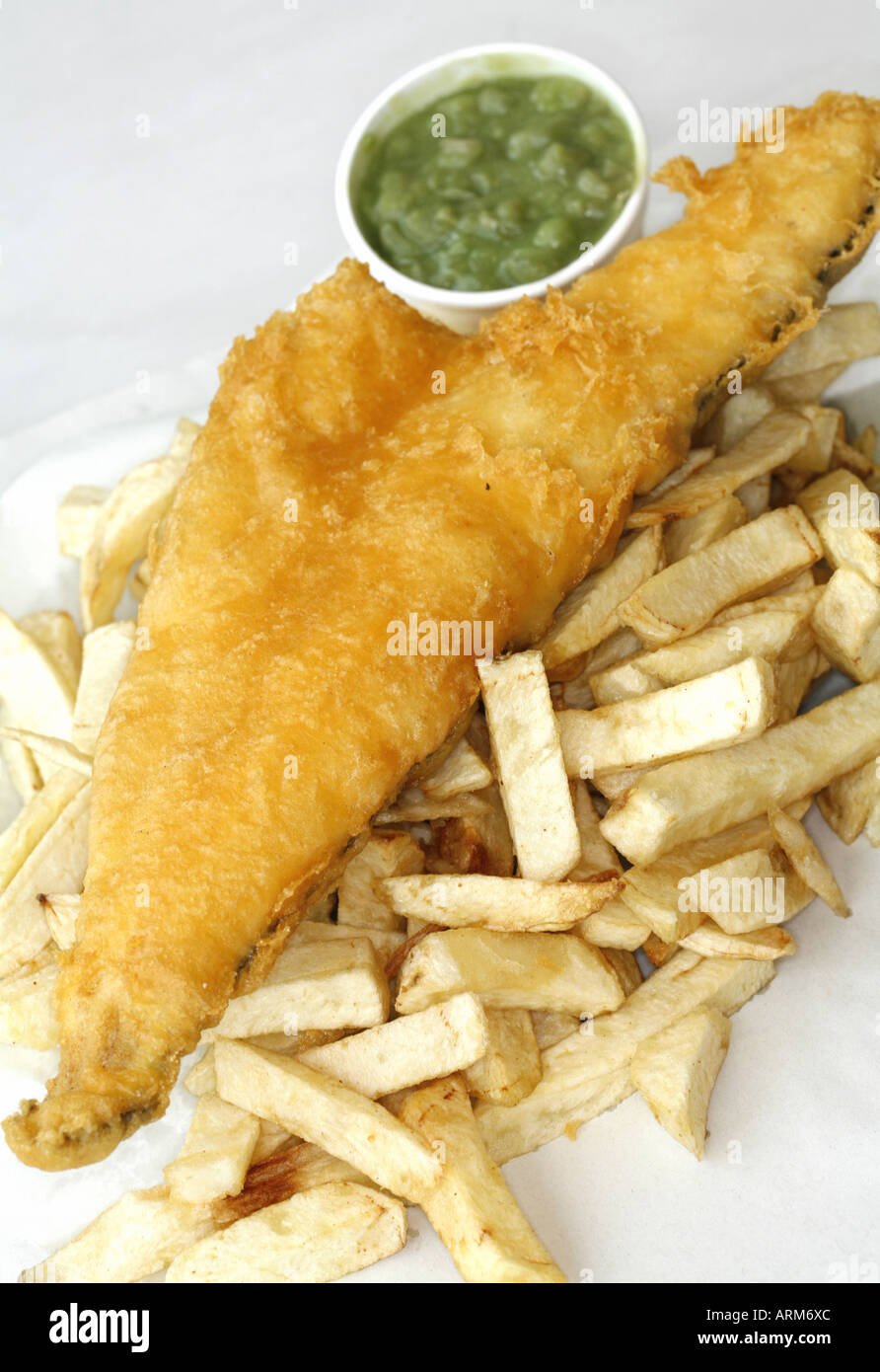 Fish cod and chips and mushy peas from a chip shop Stock Photo - Alamy