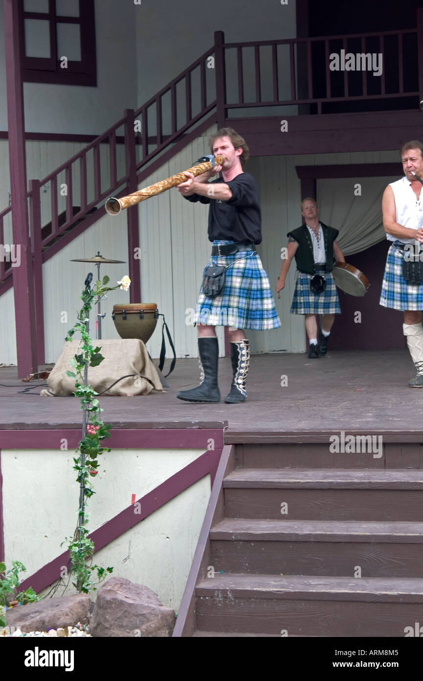 Celtic musician blow wind instrument on the stage, Renaissance Fair,USA ...