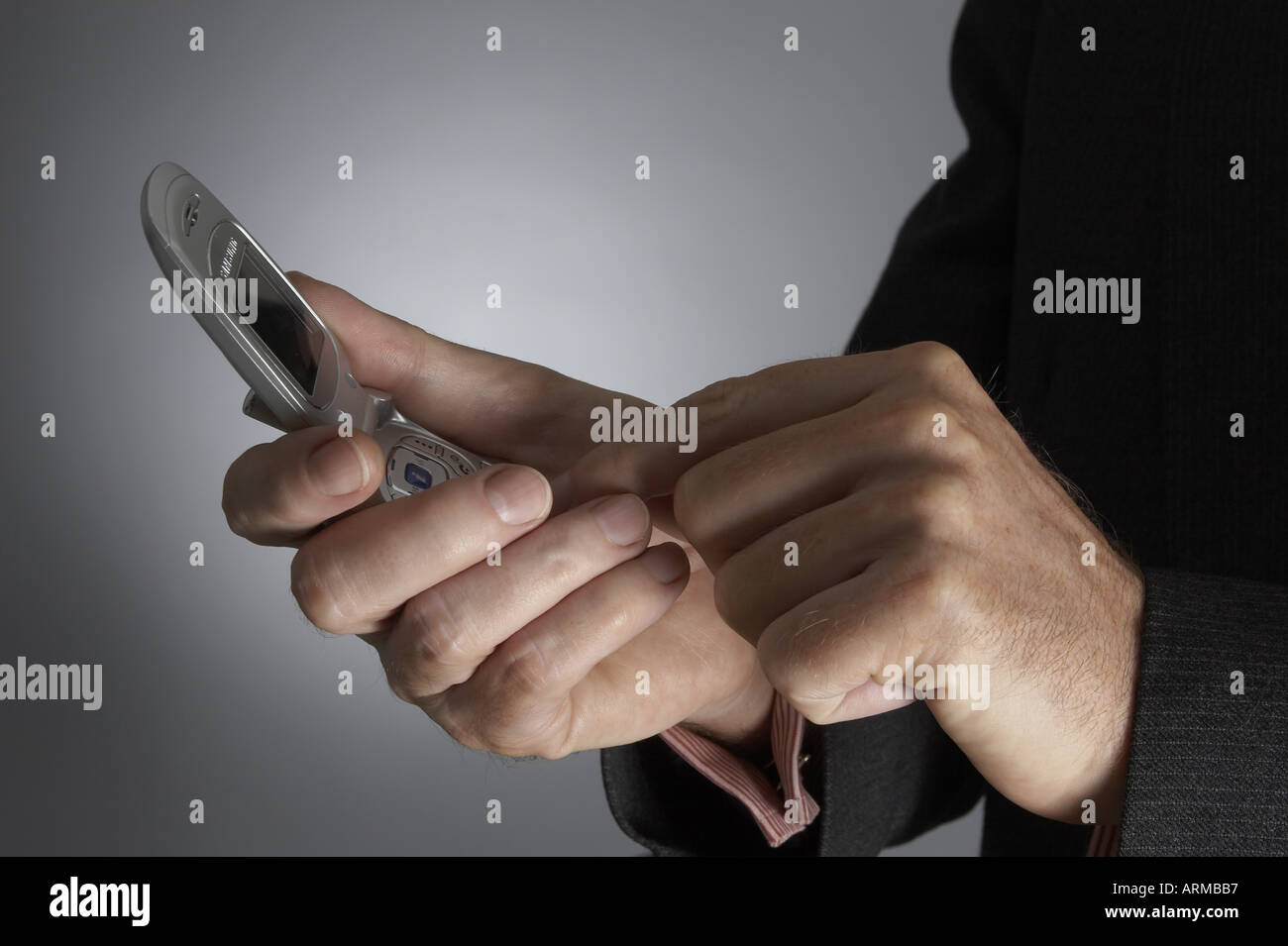 Corporate business man in suit dialling and making phone call on mobile ...