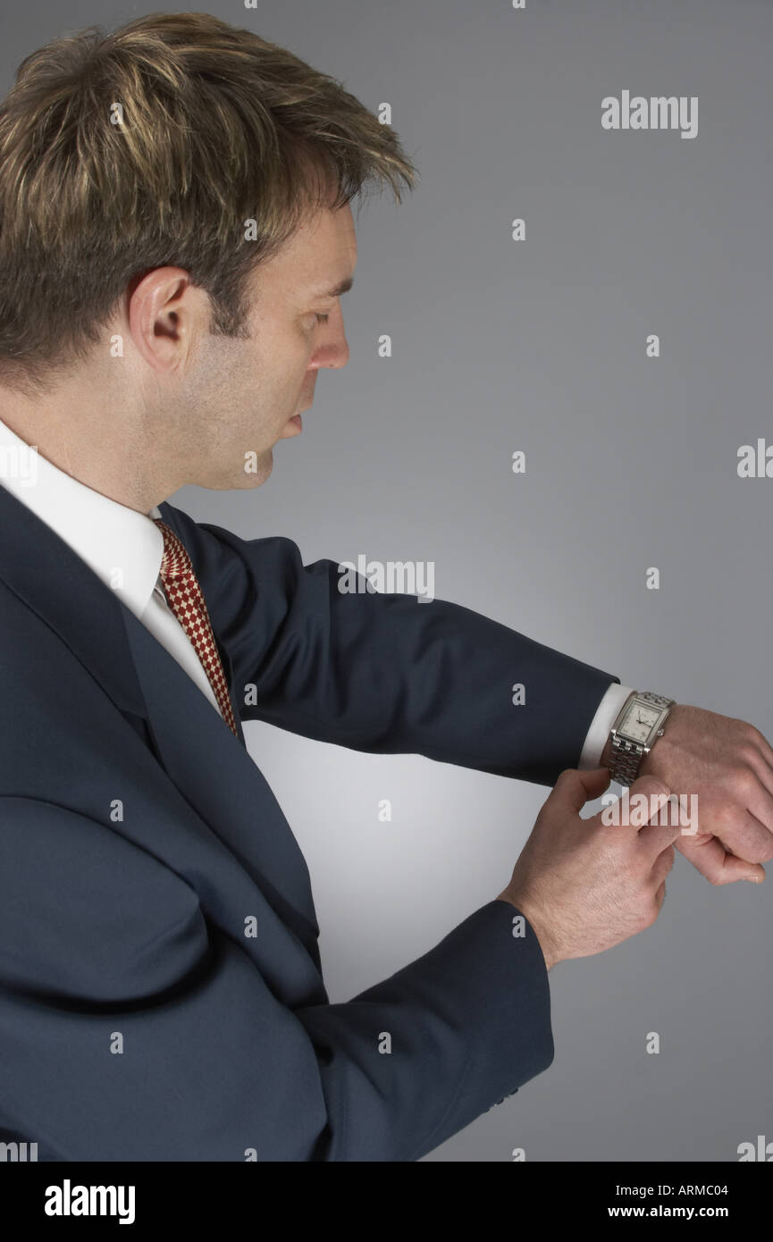 Man with a wrist watch hi-res stock photography and images - Alamy