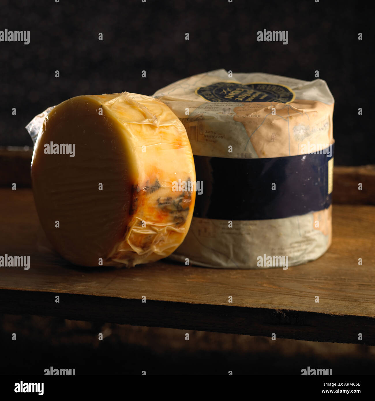 Stilton Denhay Dorset Drum Cheddar Cheese whole cheeses in packaging ...