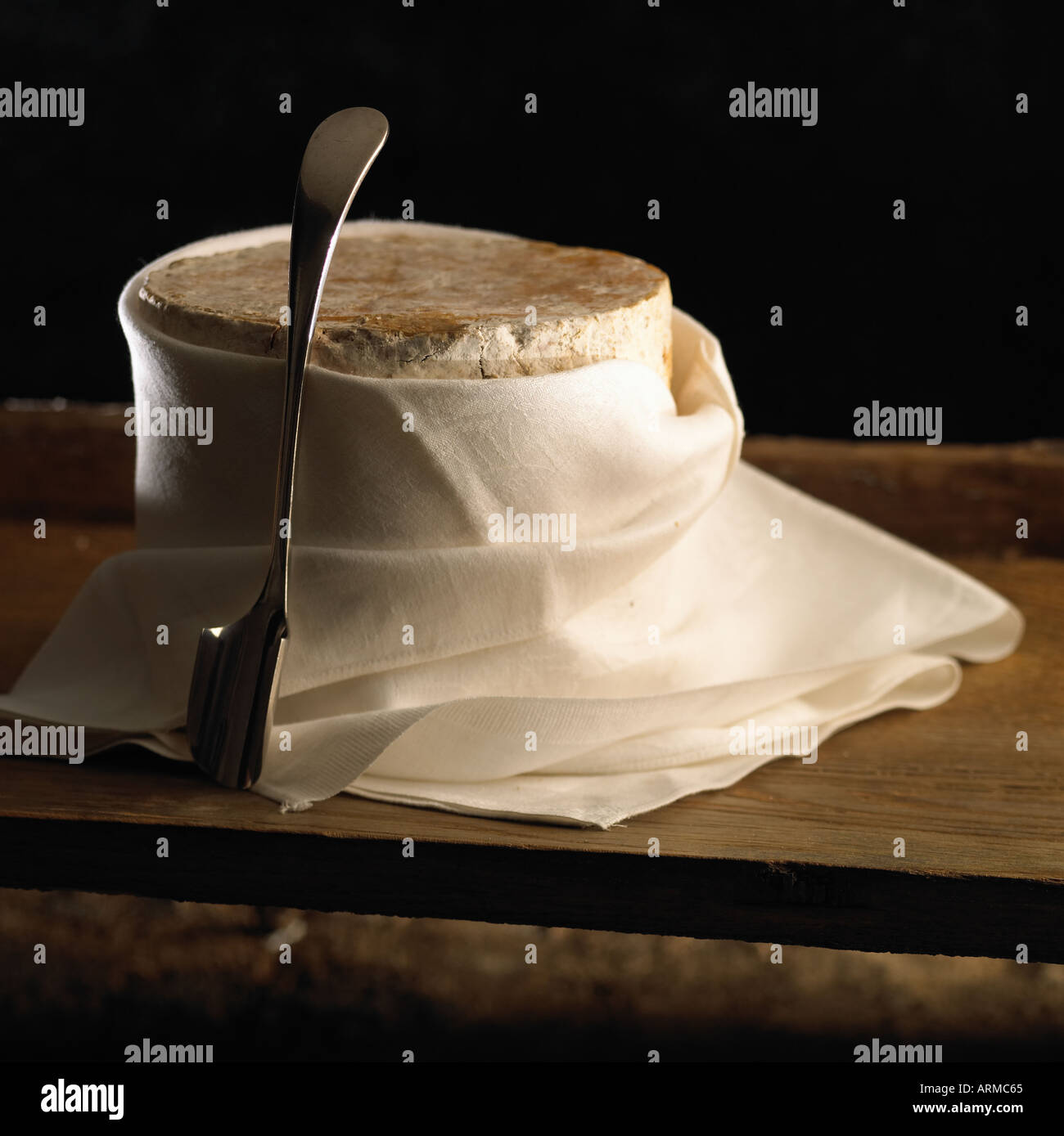 Stilton Cheese whole baby truckle wrapped in linen cloth with Stilton ...