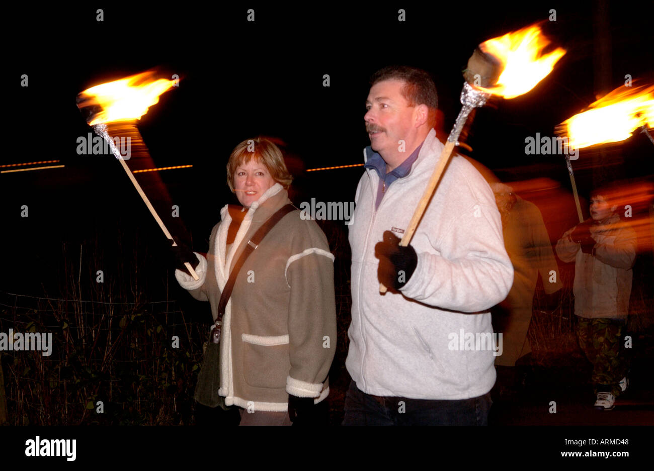 Burning torch light procession on the streets of Llanwrtyd Wells Powys ...