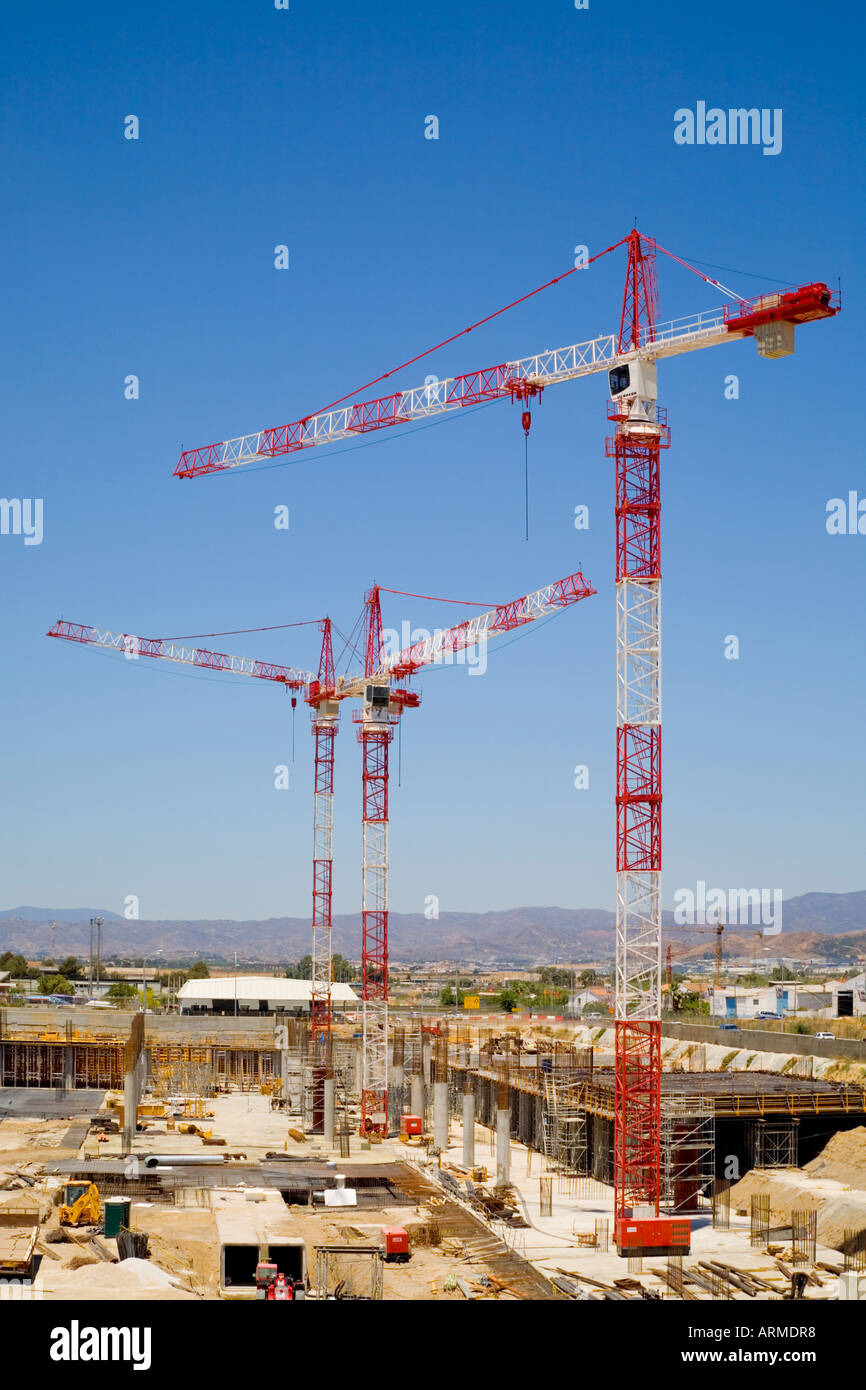 Construction cranes on building site Stock Photo - Alamy