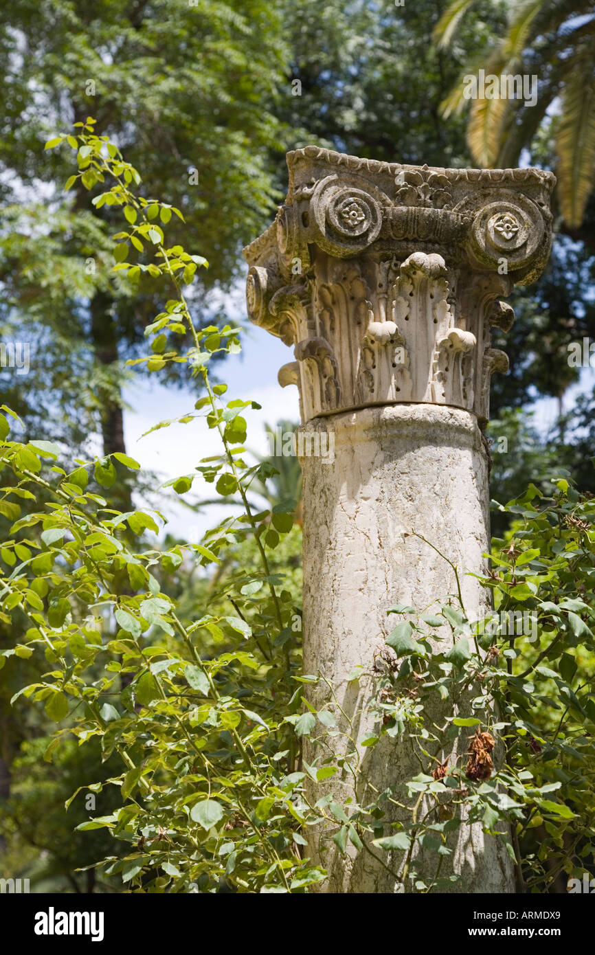 Seville Spain Column in Real Alcazar gardens Stock Photo - Alamy