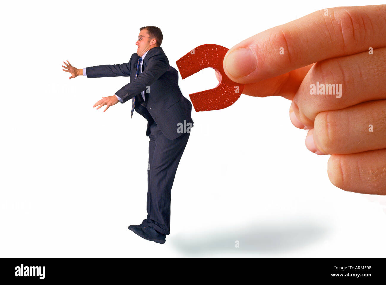 Man trapped by magnet Stock Photo - Alamy