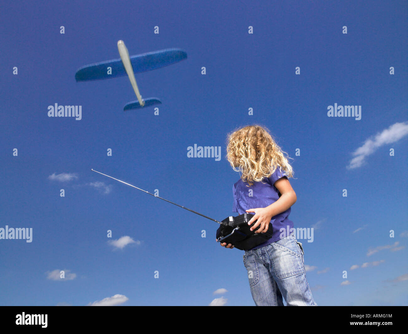 Young girl with remote-control Stock Photo - Alamy
