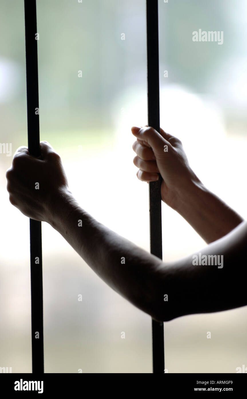 Woman prison bars hi-res stock photography and images - Alamy