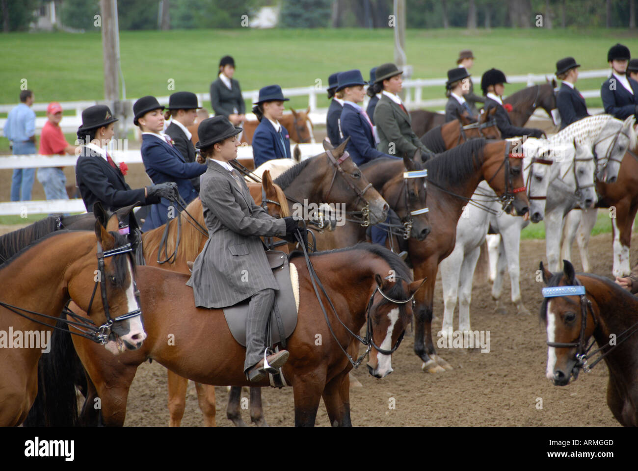 Contestants line up in the center of the ring for judging results as ...