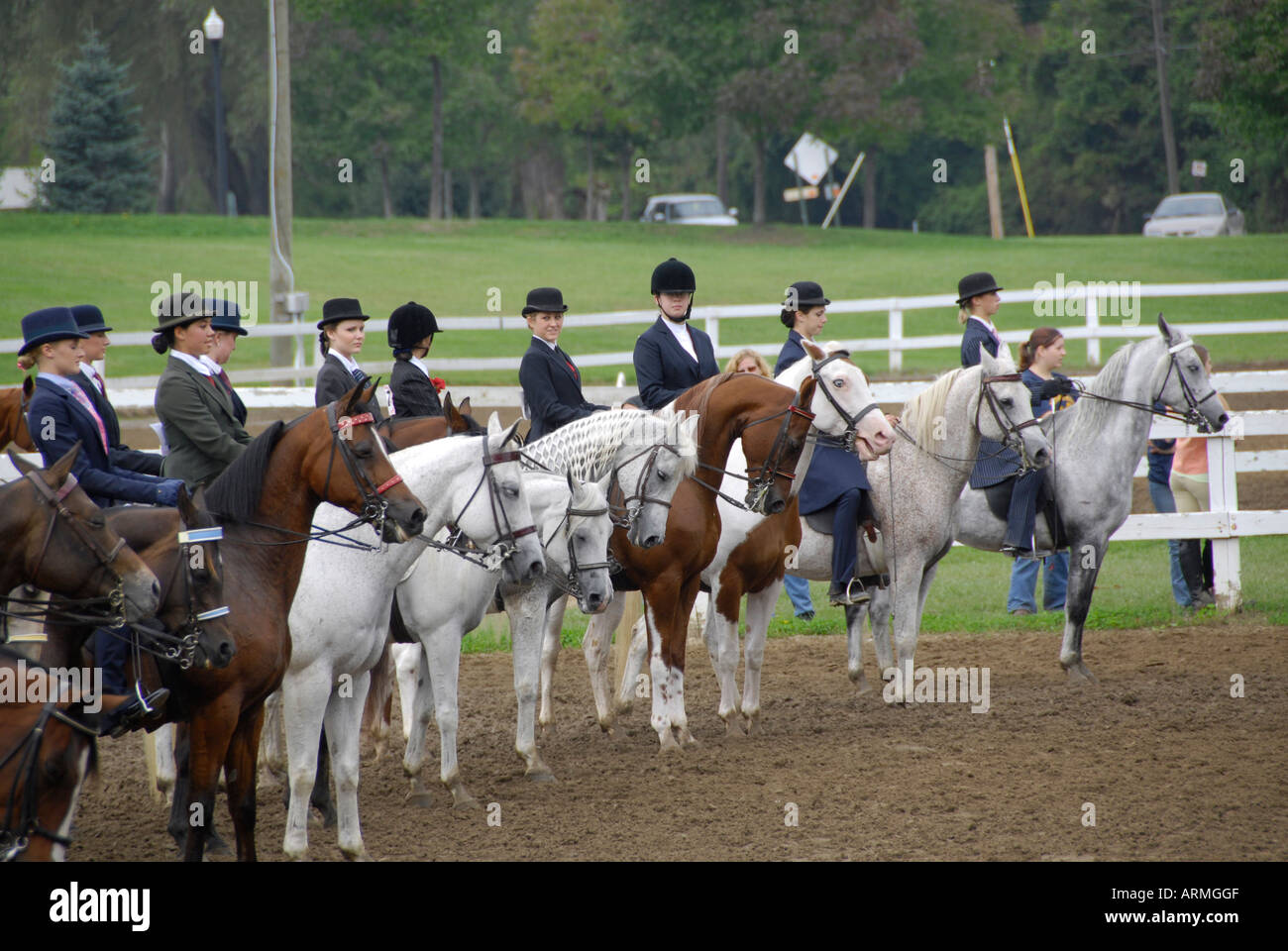 Contestants line up in the center of the ring for judging results as ...
