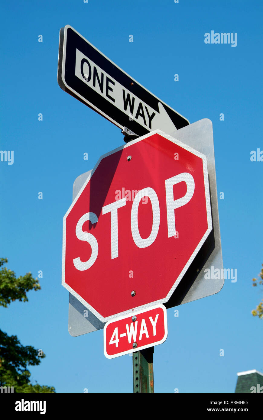 Stop sign with one way arrow Stock Photo - Alamy