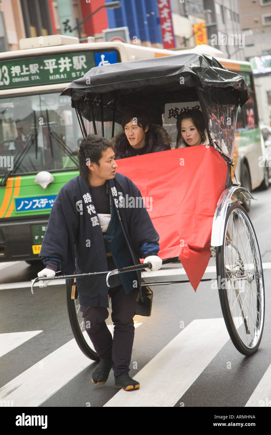 Tourists ride in a cart in Tokyo, Japan Stock Photo - Alamy