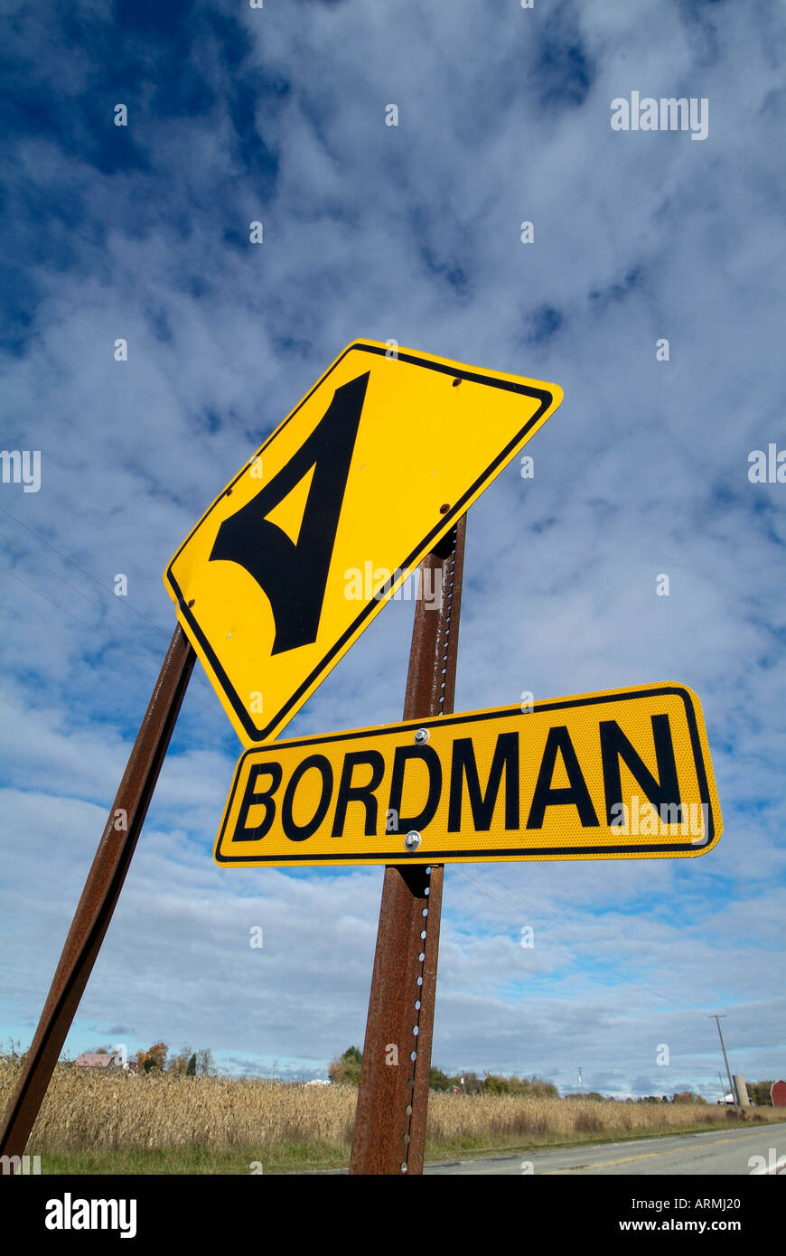 Traffic sign alerting motorist drivers that two roads meet one road ...